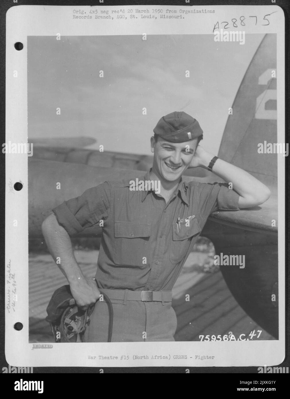 A pilot of the 90th Photographic Reconnaissance Wing, poses beside his ...