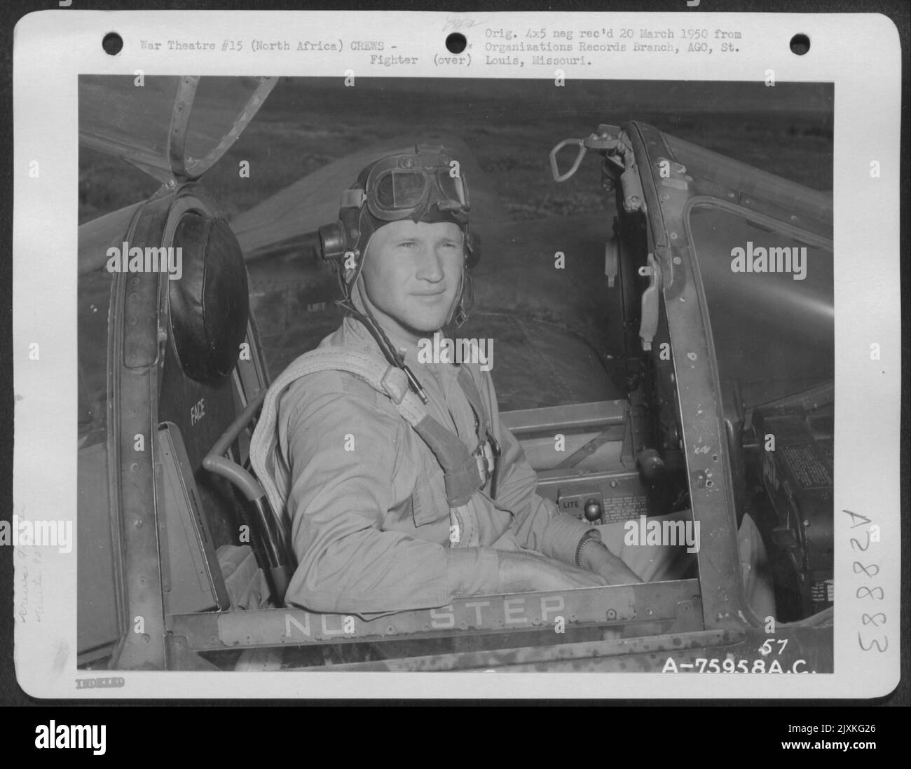 A pilot of the 90th Photographic Reconnaissance Wing, seated in the ...
