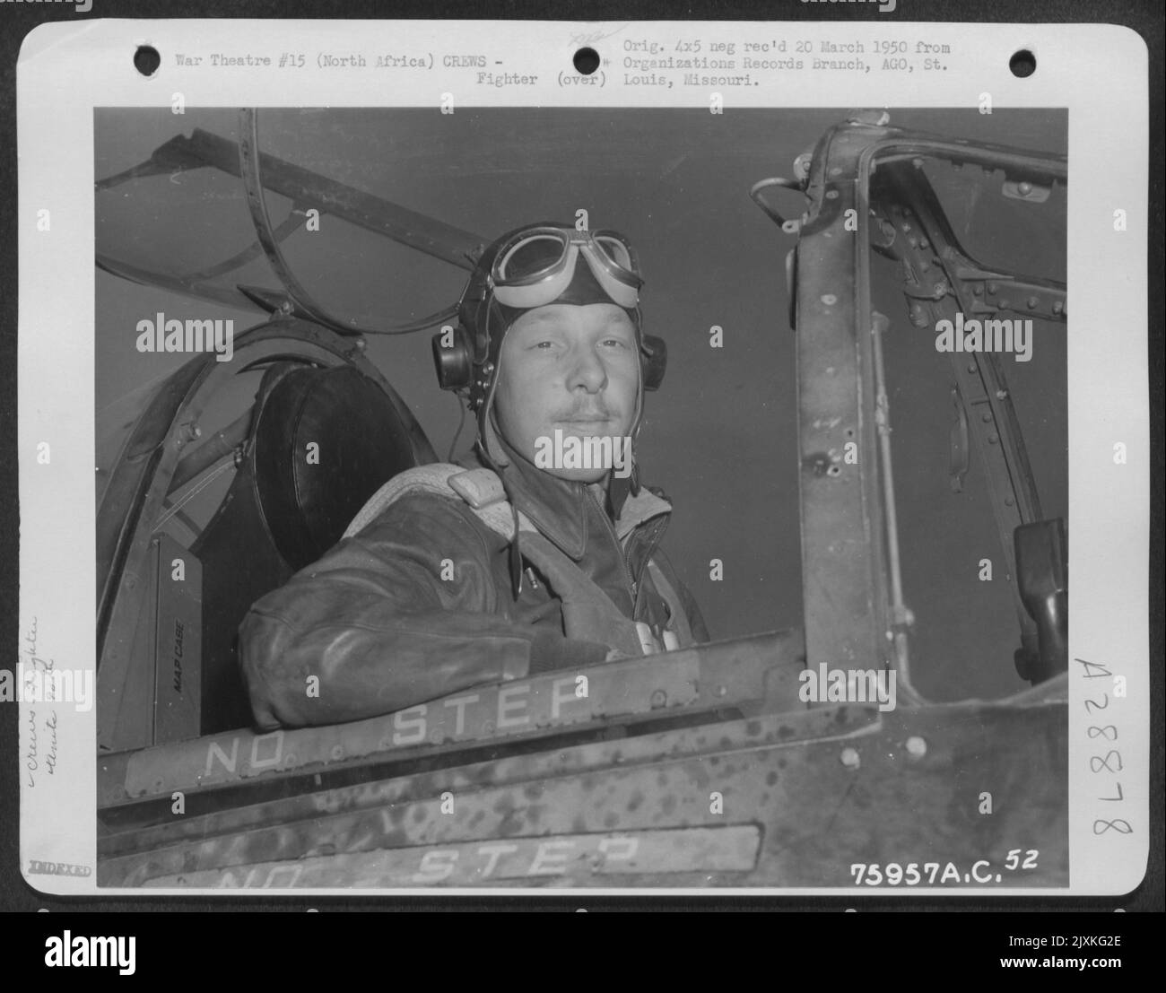A pilot of the 90th Photographic Reconnaissance Wing, seated in the ...