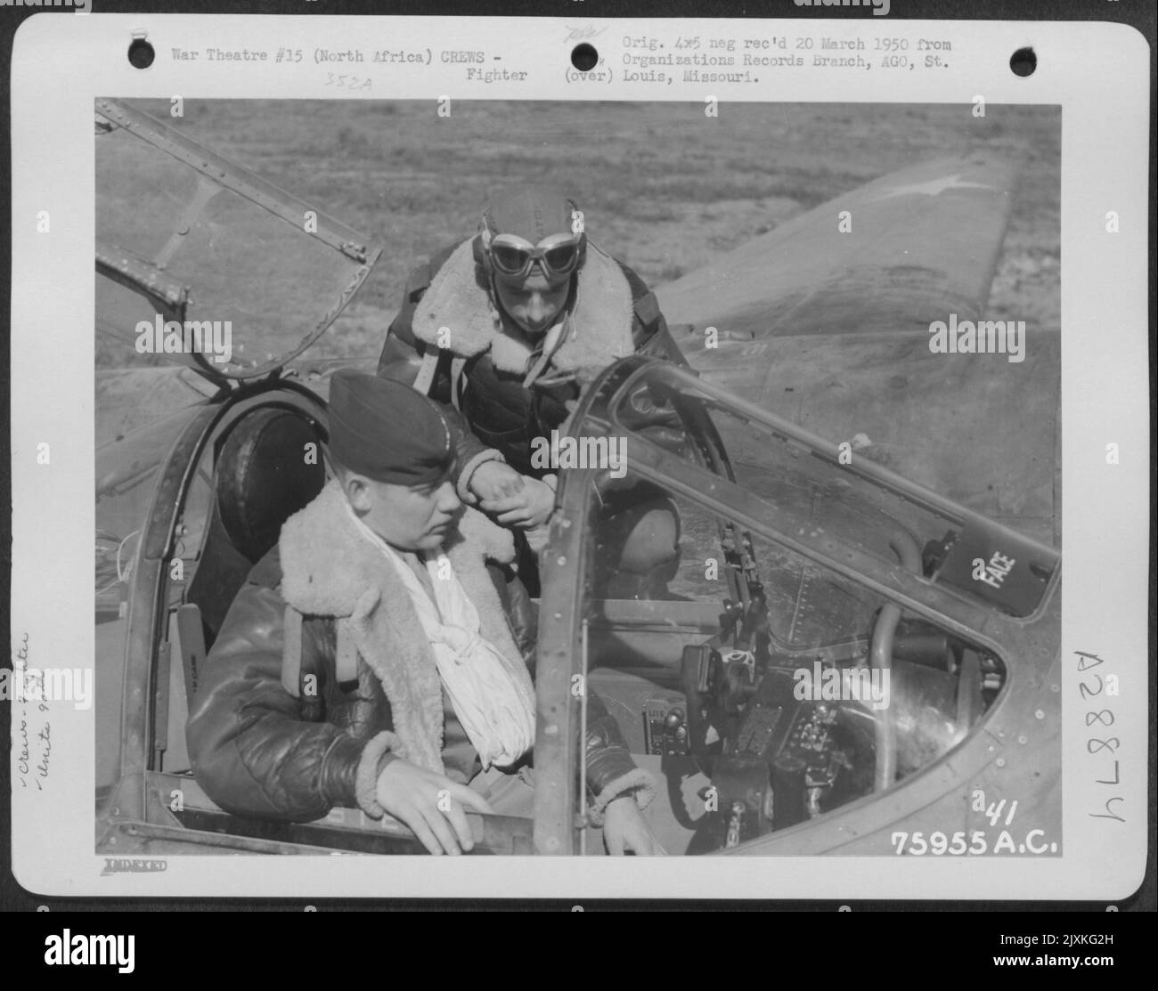 A pilot of the 90th Photographic Reconnaissance Wing, seated in the ...