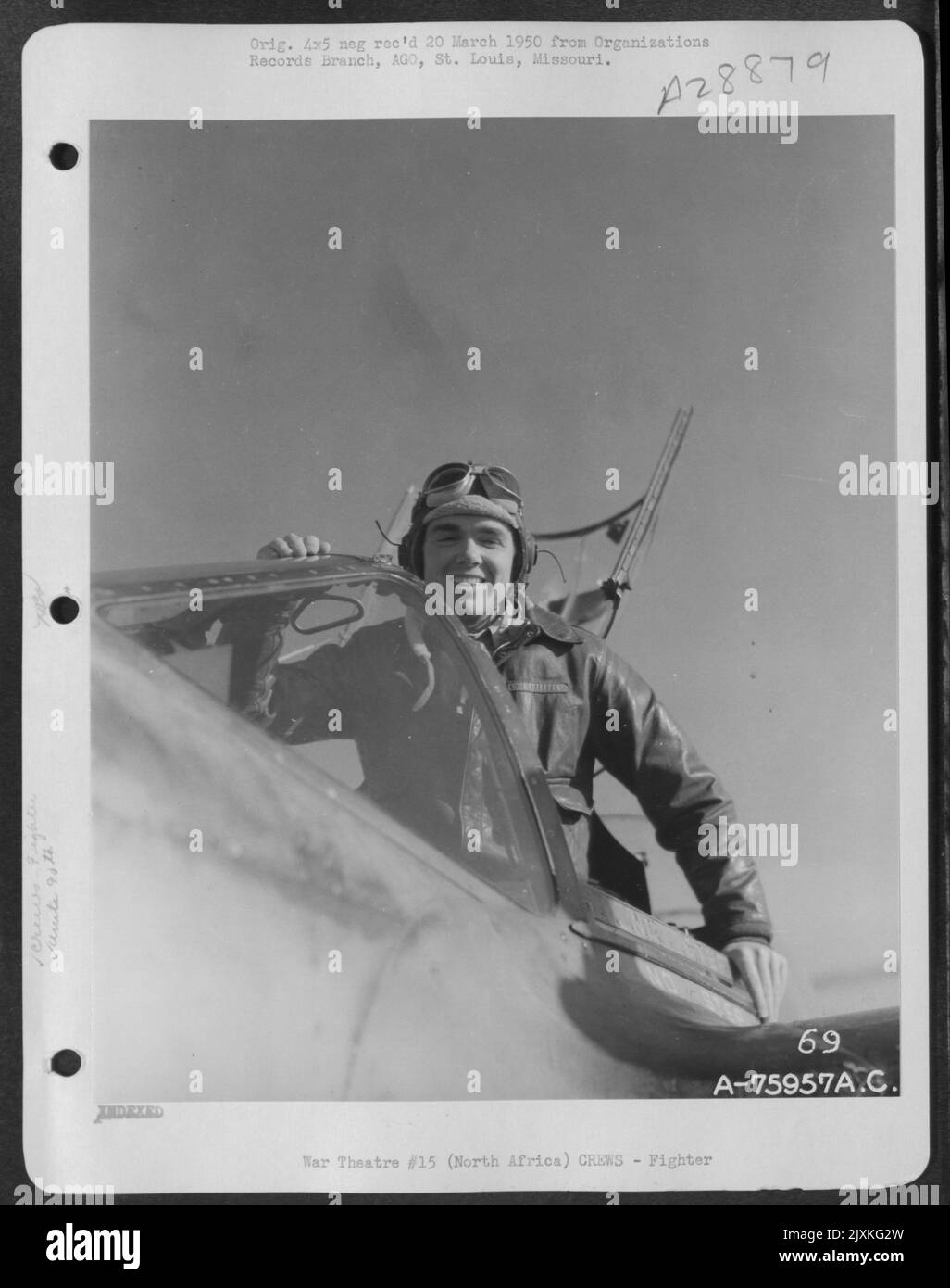 A pilot of the 90th Photographic Reconnaissance Wing, seated in the ...