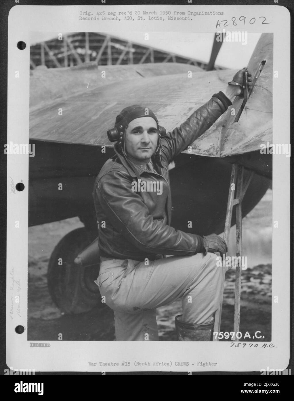 A pilot of the 90th Photographic Reconnaissance Wing, poses beside his ...