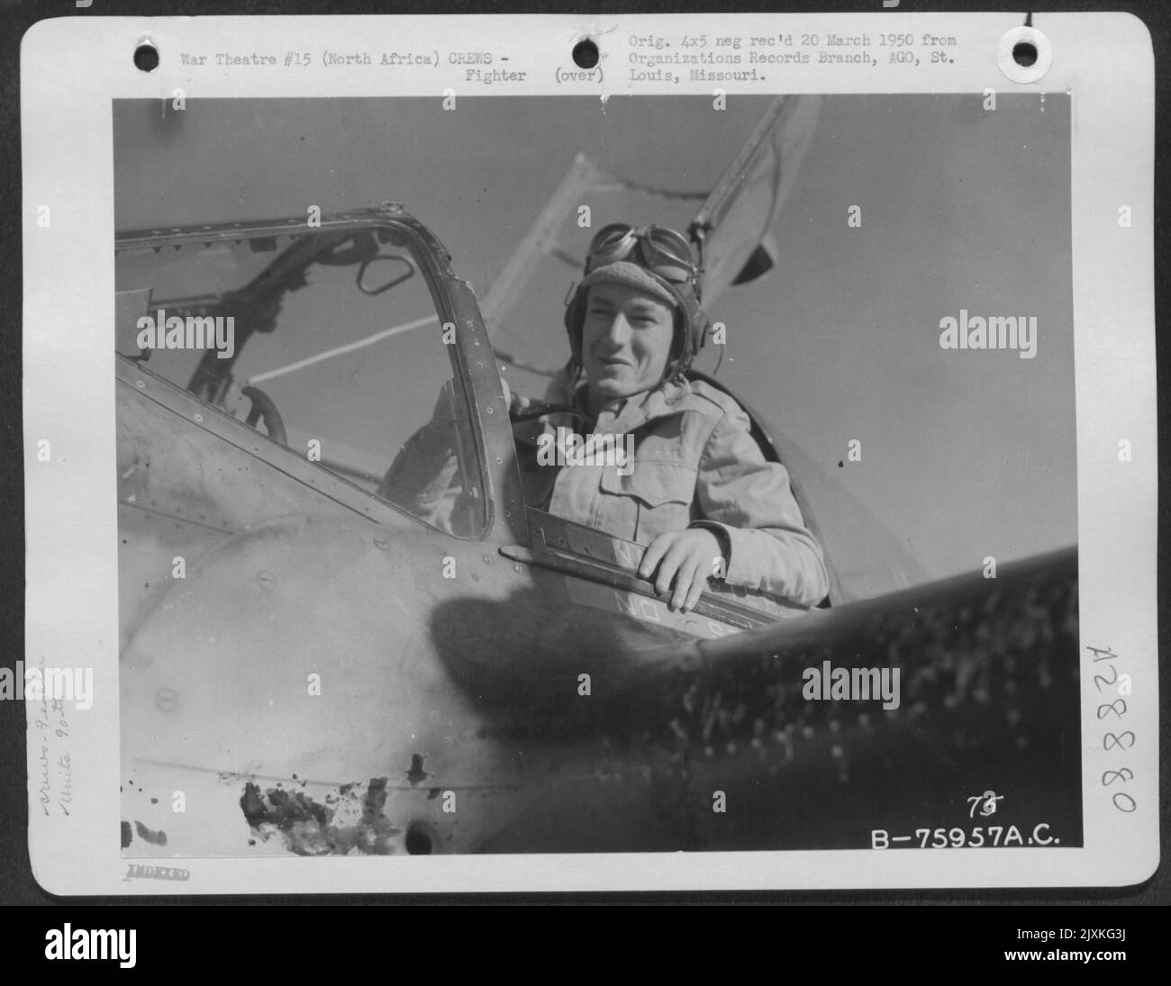 A pilot of the 90th Photographic Reconnaissance Wing, seated in the ...