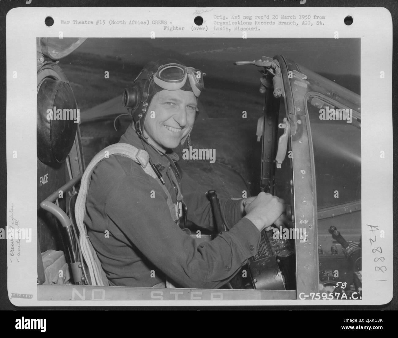 A pilot of the 90th Photographic Reconnaissance Wing, seated in the ...