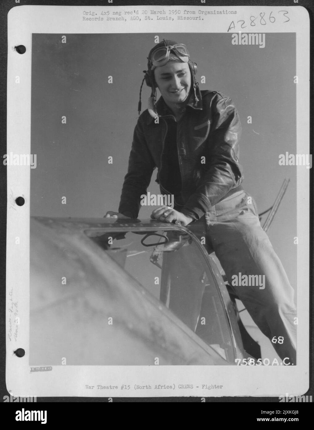 A pilot of the 90th Photographic Reconnaissance Wing, steps into the ...
