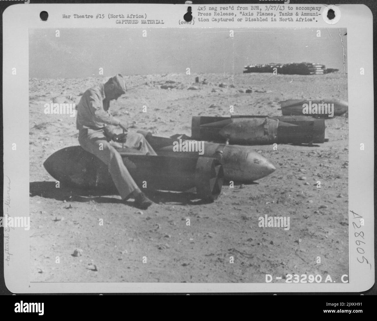 North Africa-Lt. Graham removes the fuse from a German 500-pound bomb ...