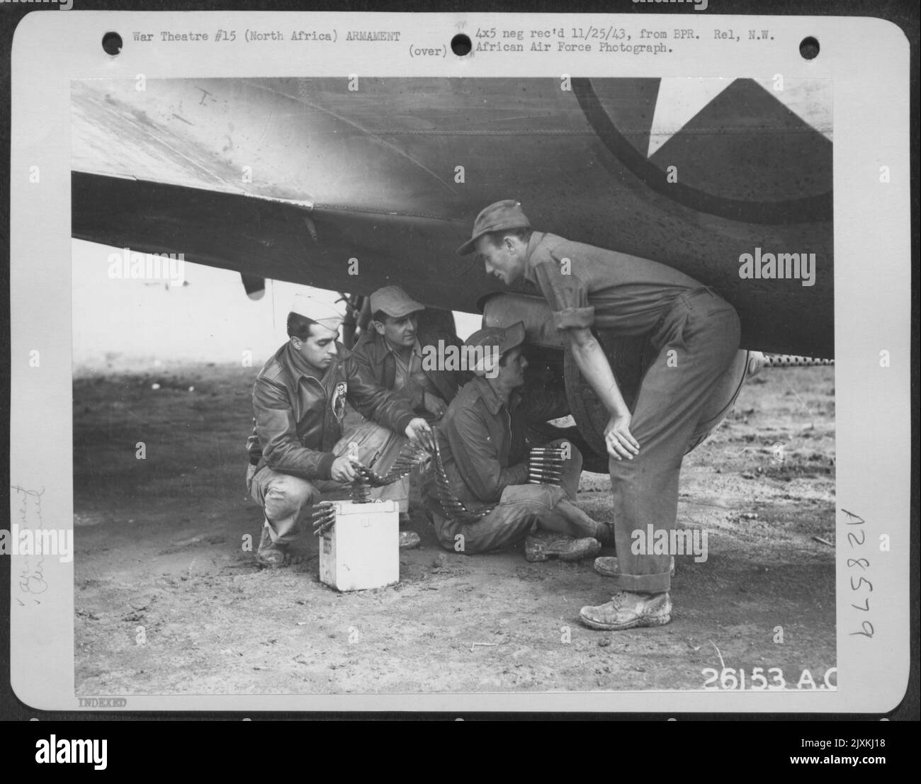 Loading a headache for enemy fighters into the lower turret of a Boeing ...