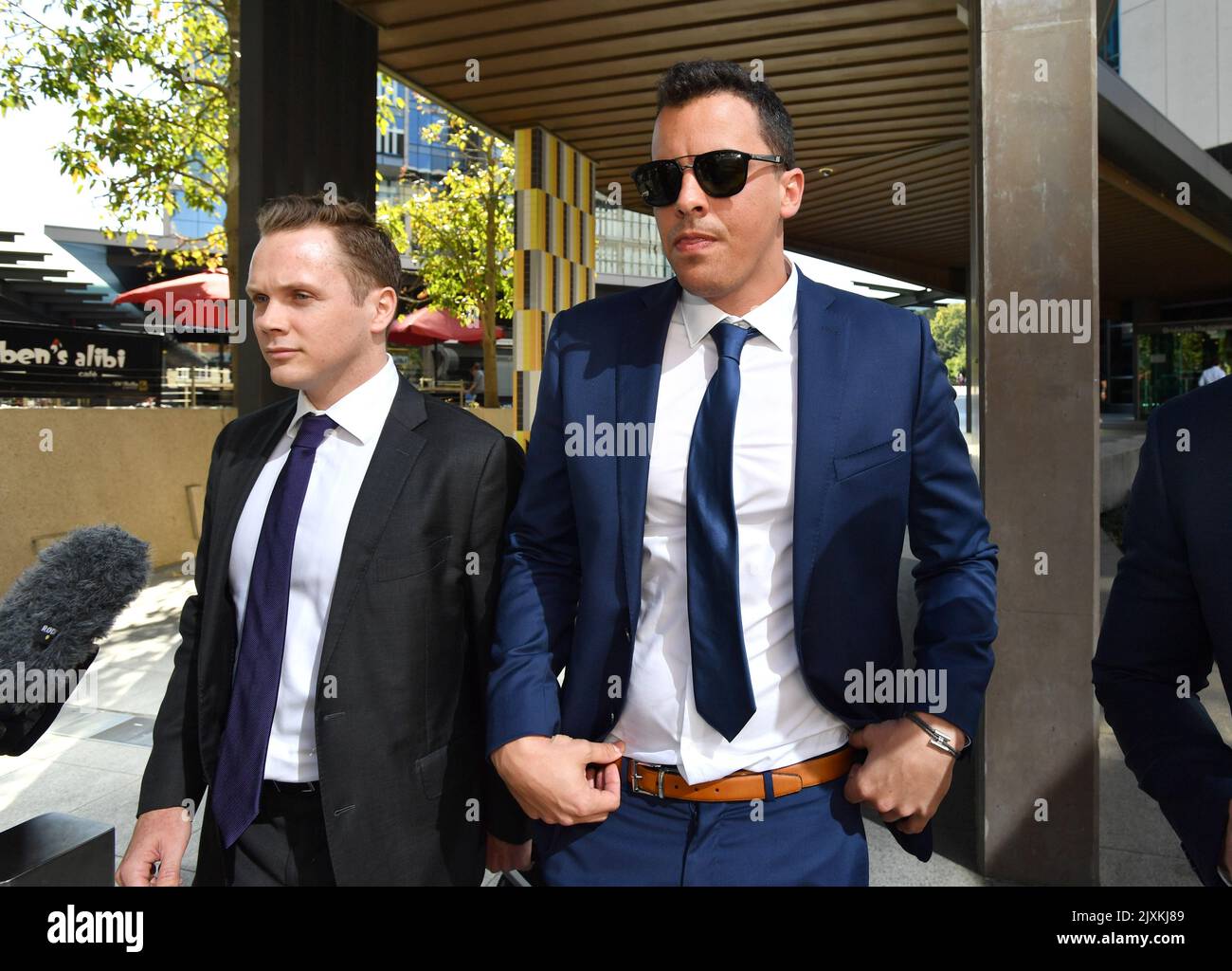 Former tennis professional Isaac Frost (right) is seen leaving the ...