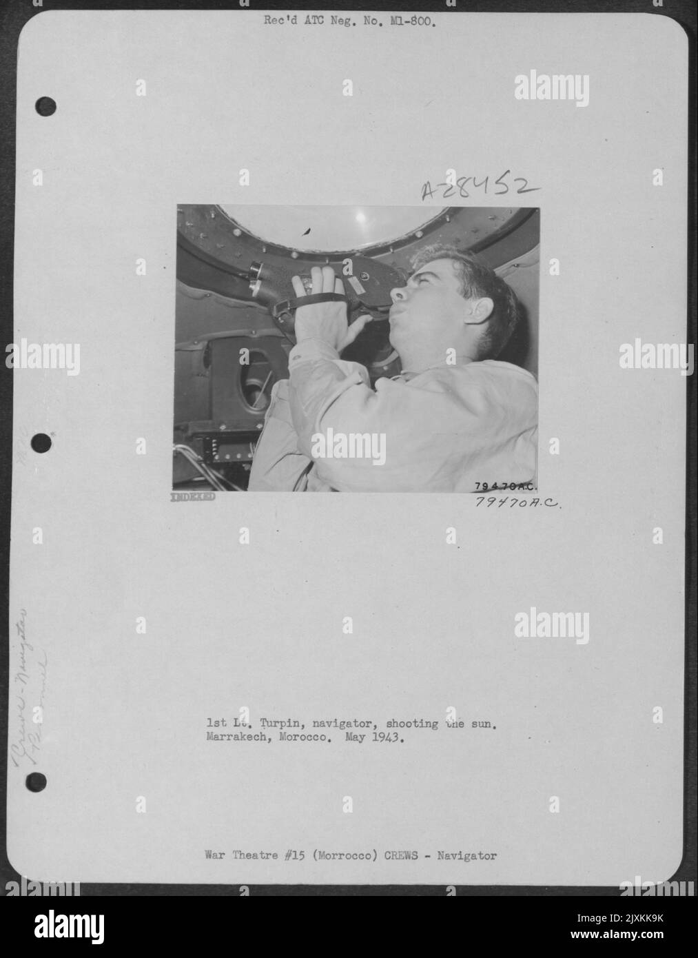 1st Lt. Turpin, navigator, shooting the sun. Marrakech, Morocco. May ...