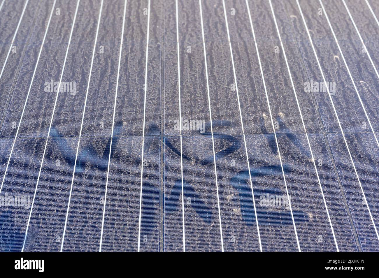 Dust covered solar panel with Wash Me sated Stock Photo - Alamy