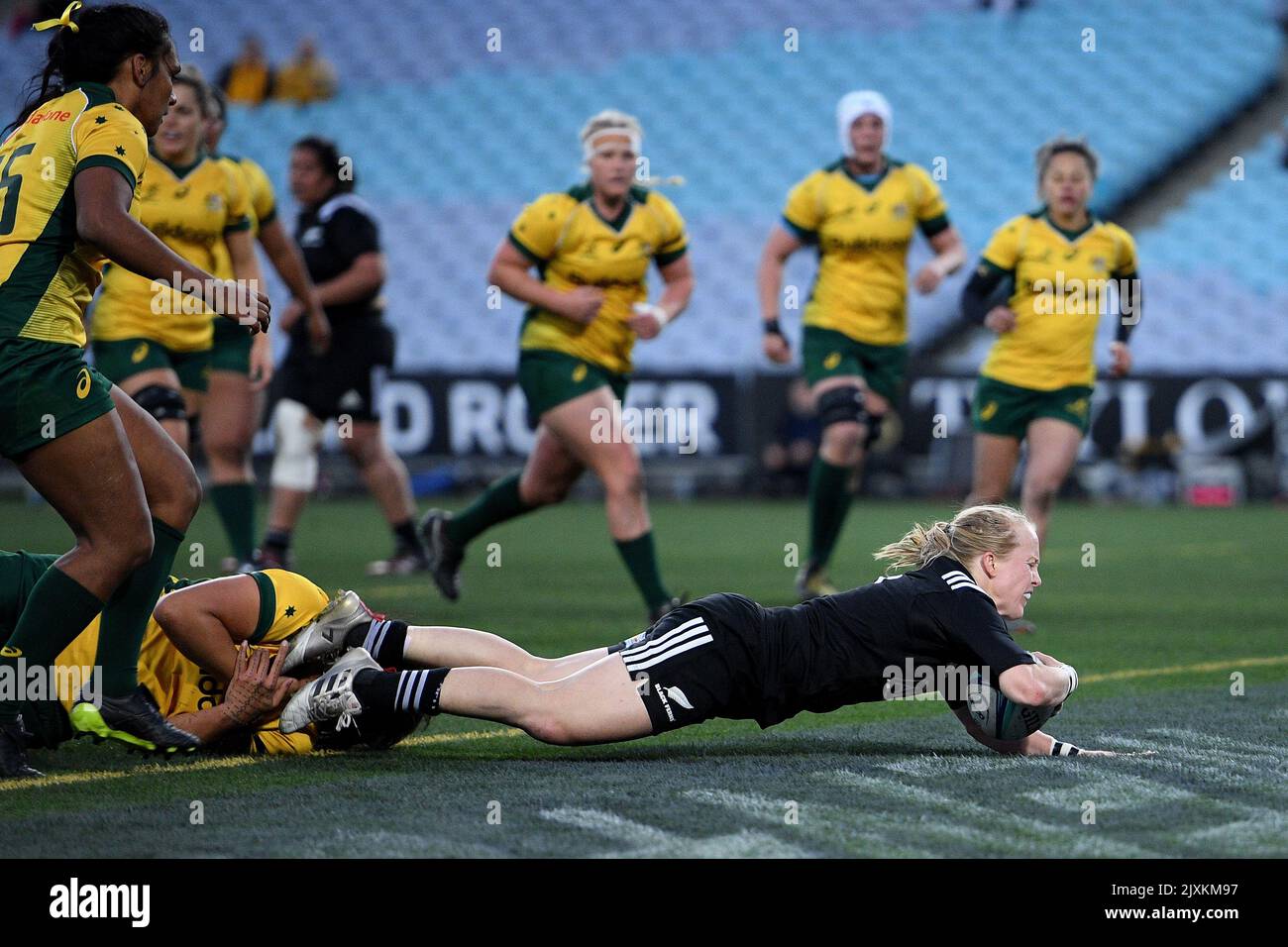 Kendra Cocksedge of the Black Ferns scores a try during the Women's ...