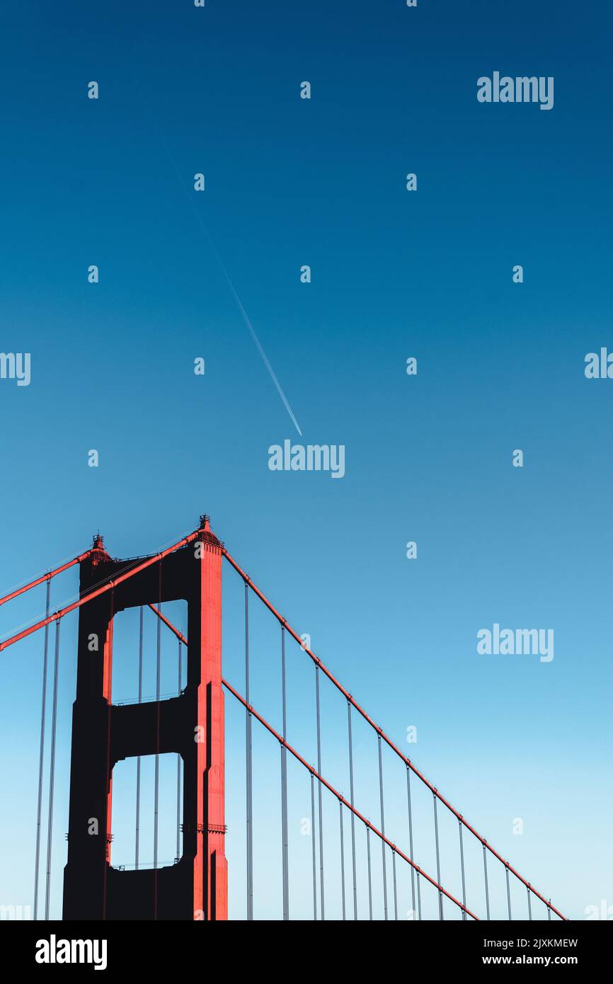 A lending plane trail above the Golden Gate Bridge Stock Photo - Alamy