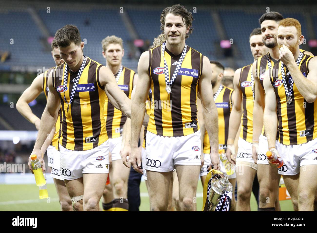 Isaac Smith of the Hawks (centre) leads the Hawks off the ground with ...