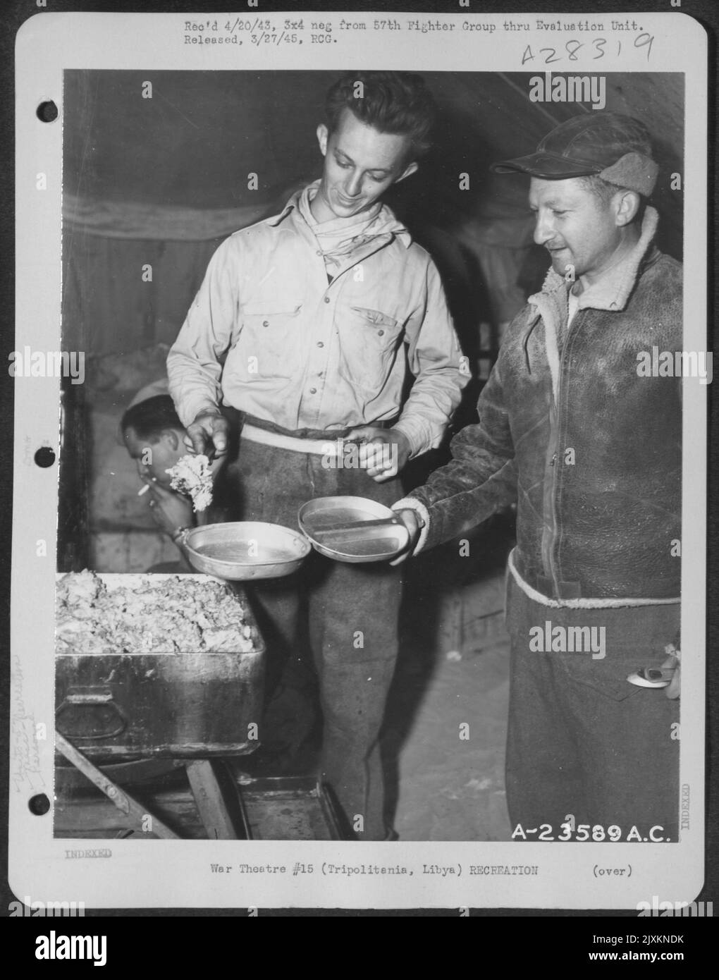 Sgt. J. Thomas, Corona, Long Island, N.Y., serving stew to Pvt. Abe ...