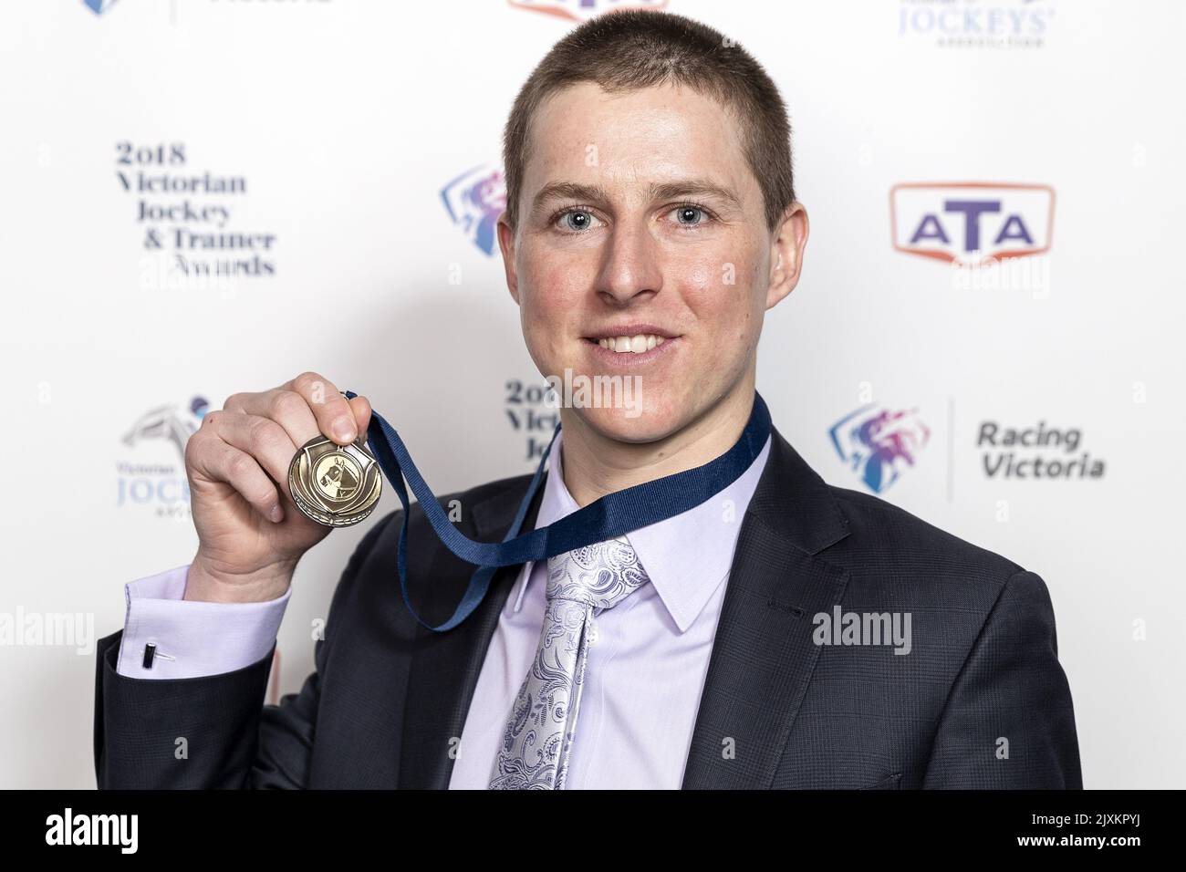Damian Lane poses for a photograph with the Most Valuable Jockey award ...
