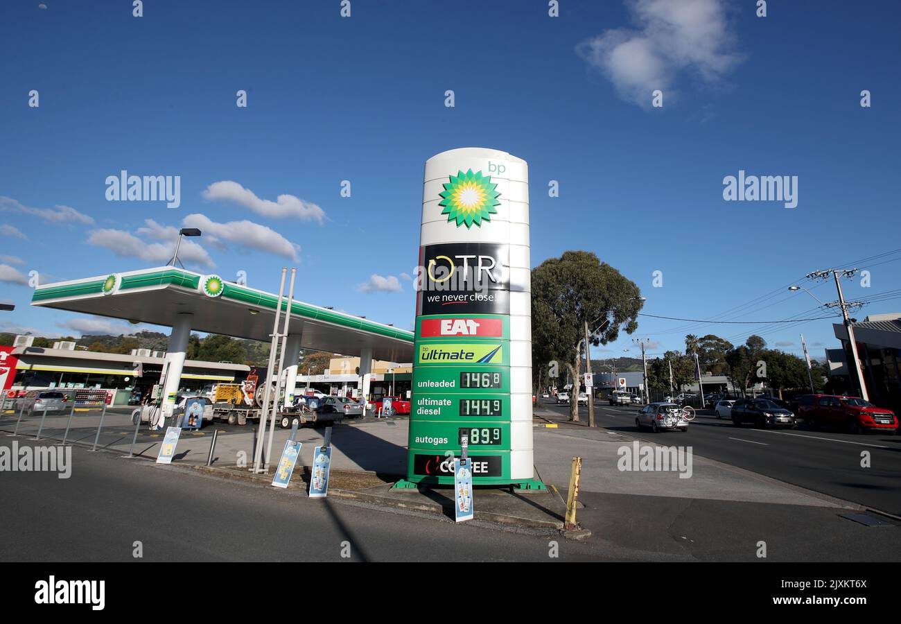 An electronic sign displays petrol prices at a service station in ...