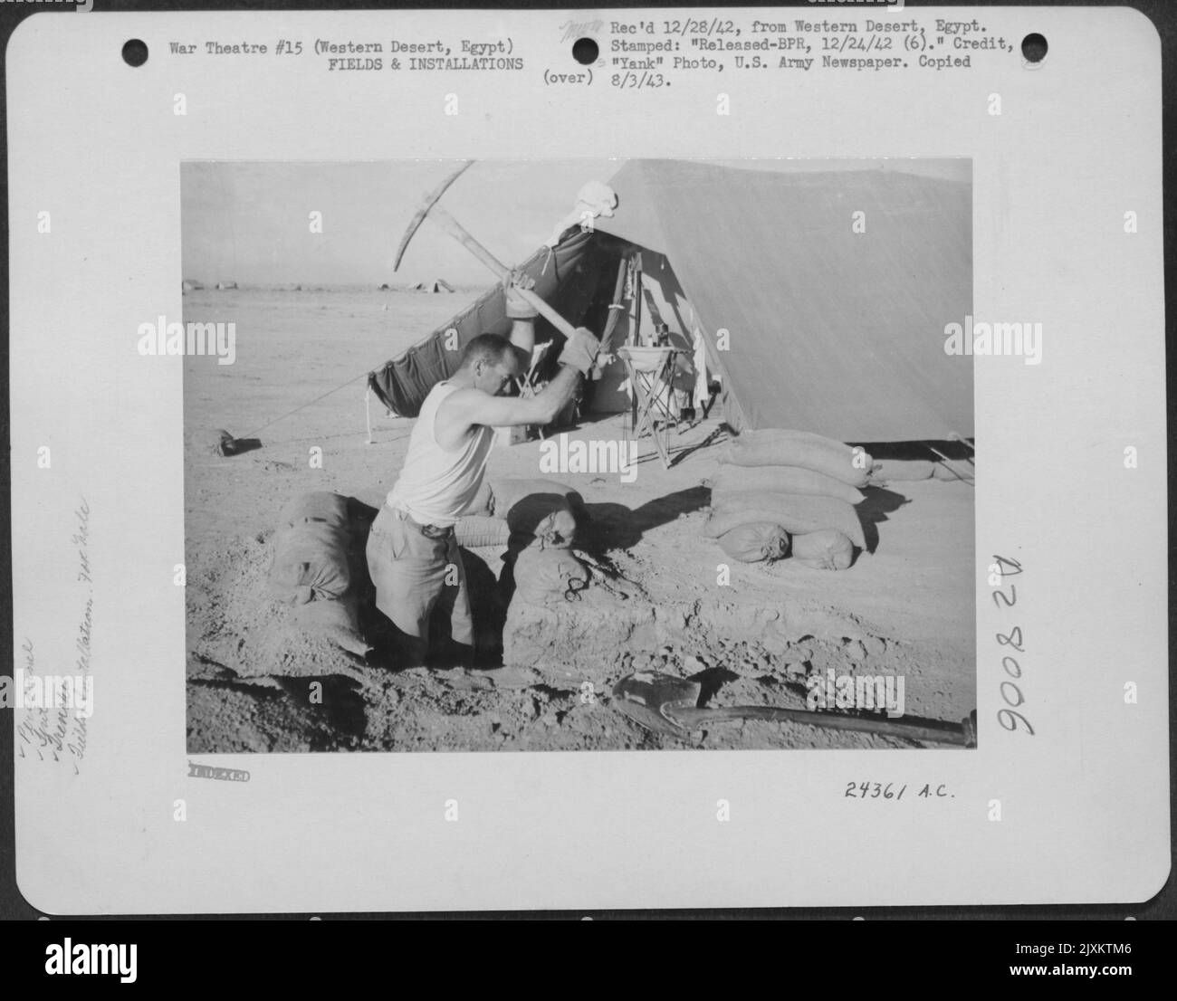 Lt. Colonel Ed. Backus, AC, digging his shelter trench somewhere in the ...