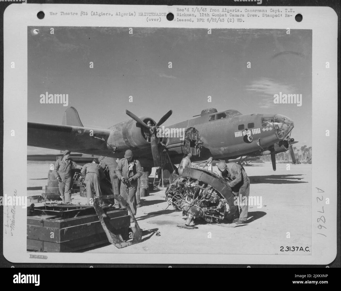 Algiers, Algeria-Men working on a Boeing B-17 "Flying Fortress" motor ...