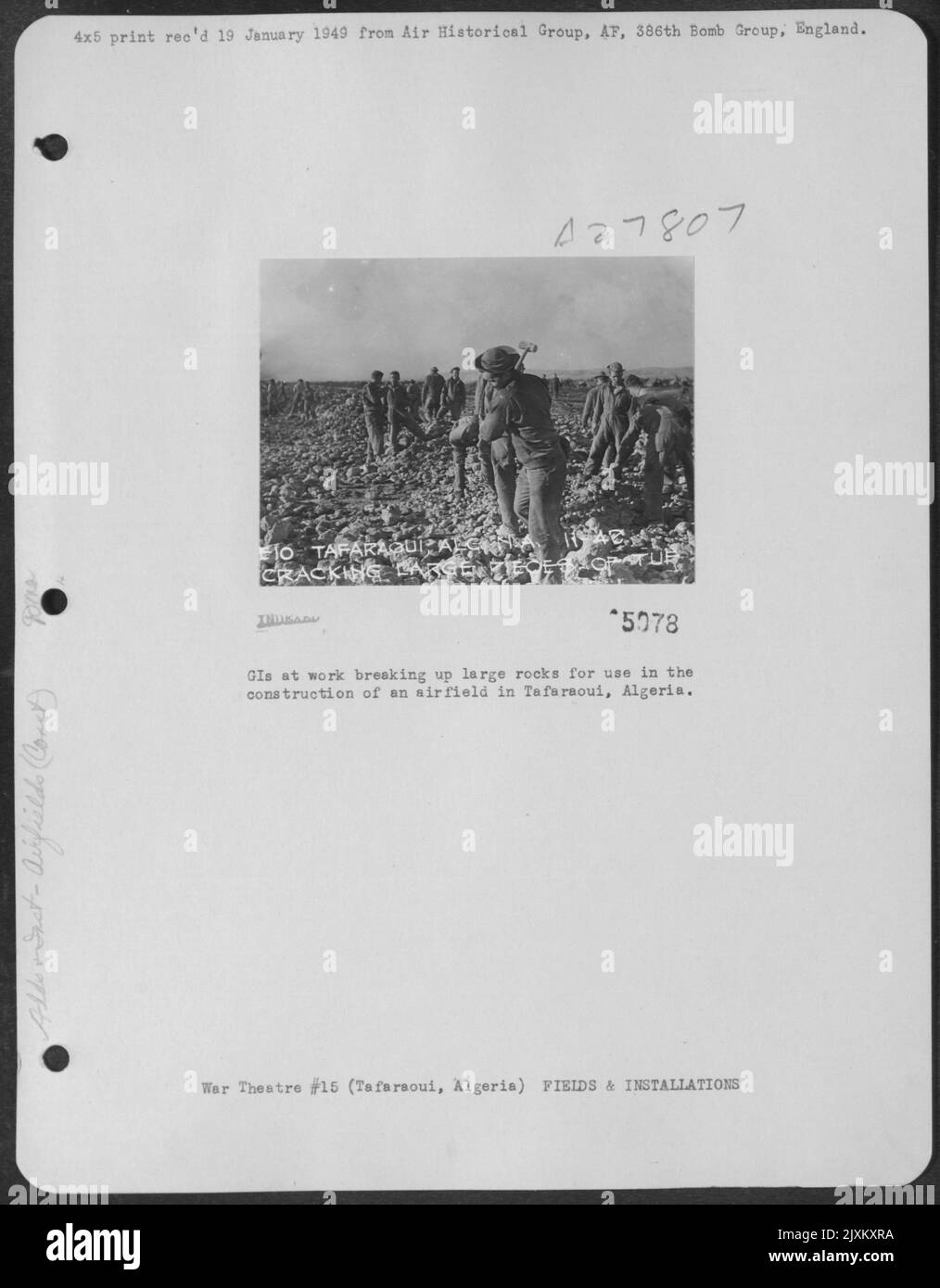 GI's at work breaking up large rocks for use in the construction of an ...