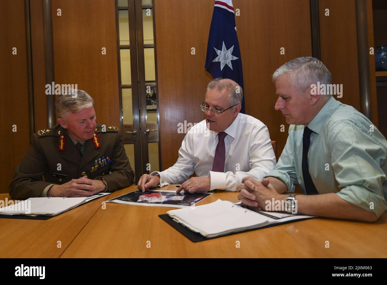 National drought coordinator Major General Stephen Day (left) is seen ...