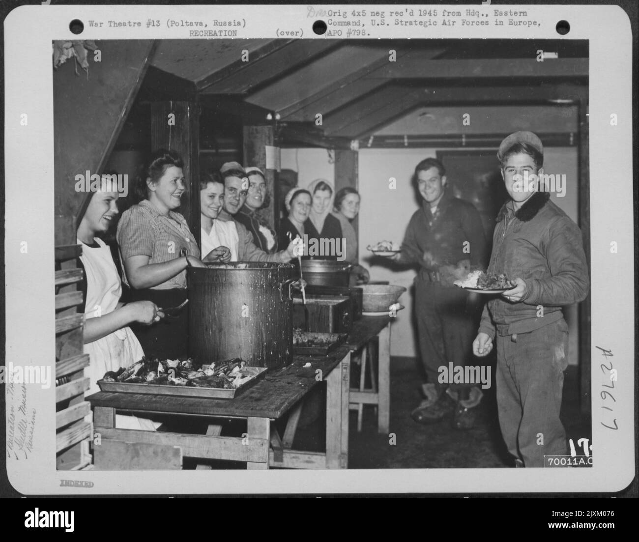 Gi'S, Holding Plates Heaped With Food, Grin Broadly As They Pass Thru ...