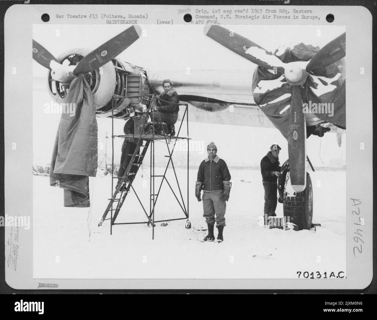 American-Russian Ground Crew Personnel Repair One Of The Engines On A ...