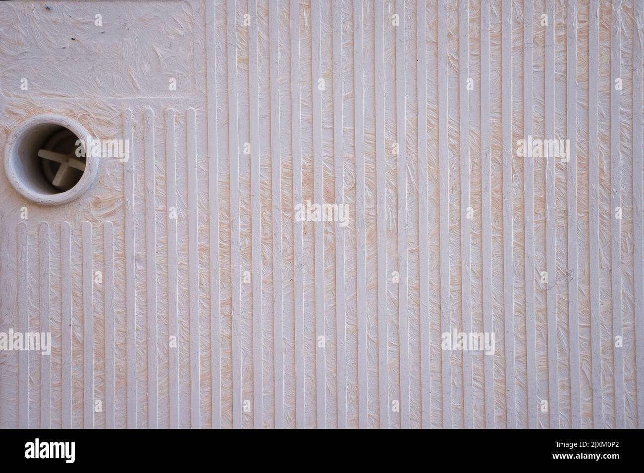 A wall with stripes and a hole on the left side Stock Photo - Alamy