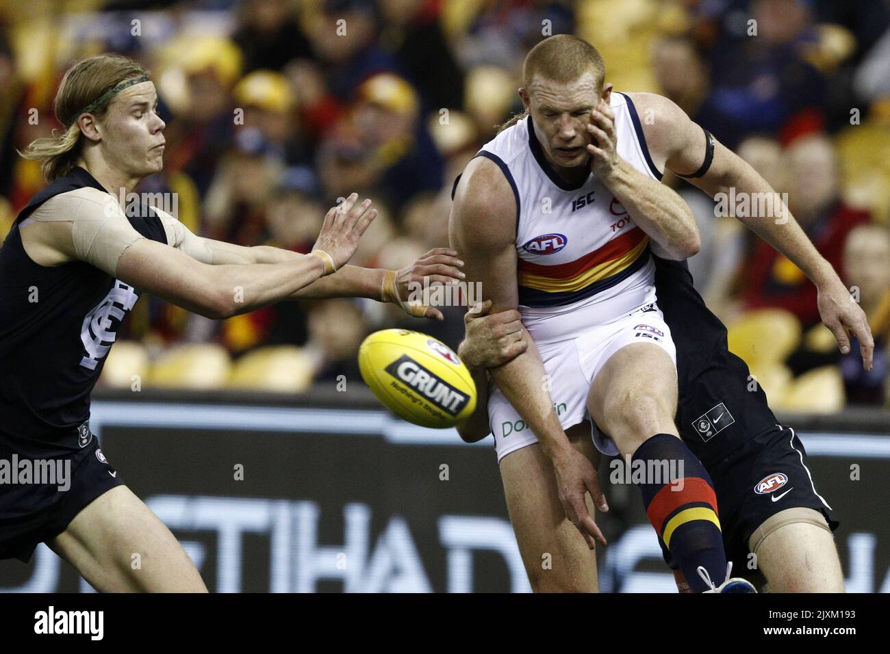 Sam Jacobs of the Crows is tackled during the Round 23 AFL match ...