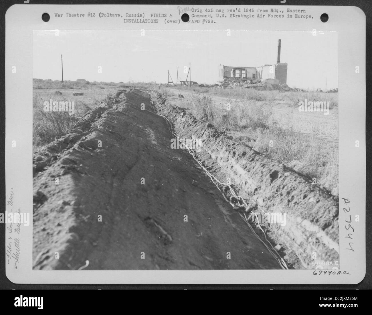 Communication cables are laid in a ditch at Poltava Airbase, a shuttle ...