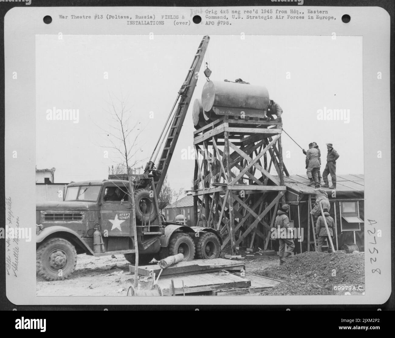 Storage tanks are put in place on a platform near the winter quarters ...