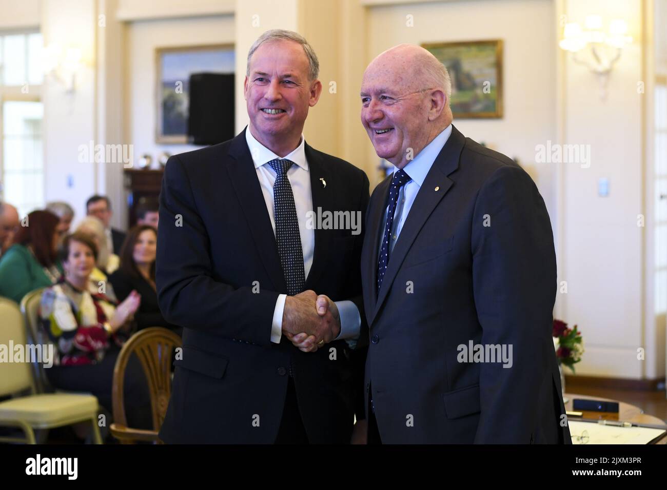 Senator Richard Colbeck (left) shakes hands with Australian Governor ...