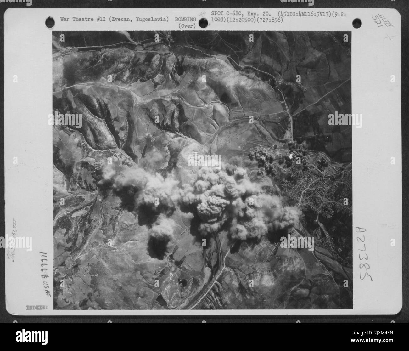 Enemy installations at Zvecan, Yugoslavia are covered with bomb bursts ...