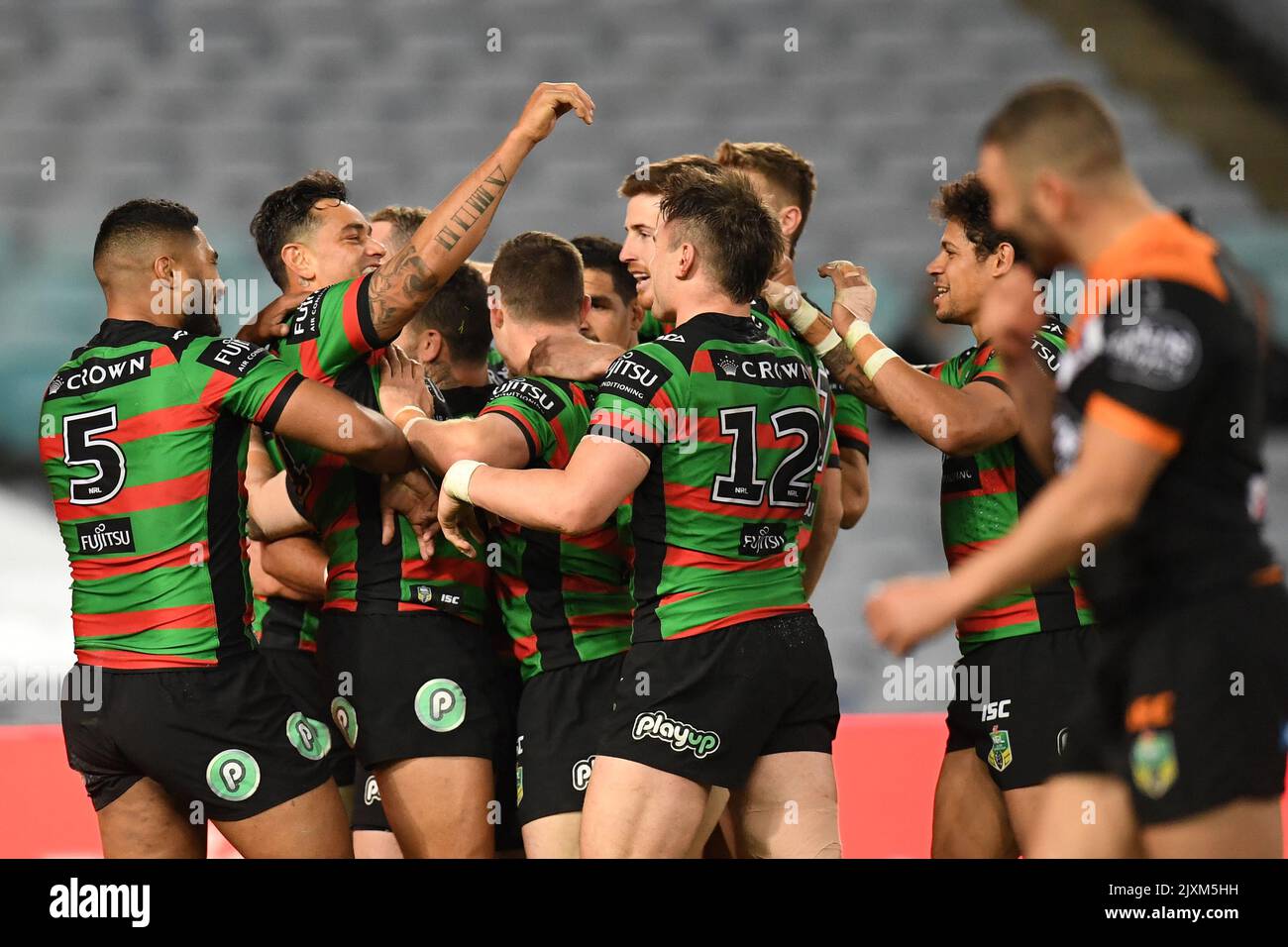 The Rabbitohs celebrate Alex Johnston's try during the Round 25 NRL ...