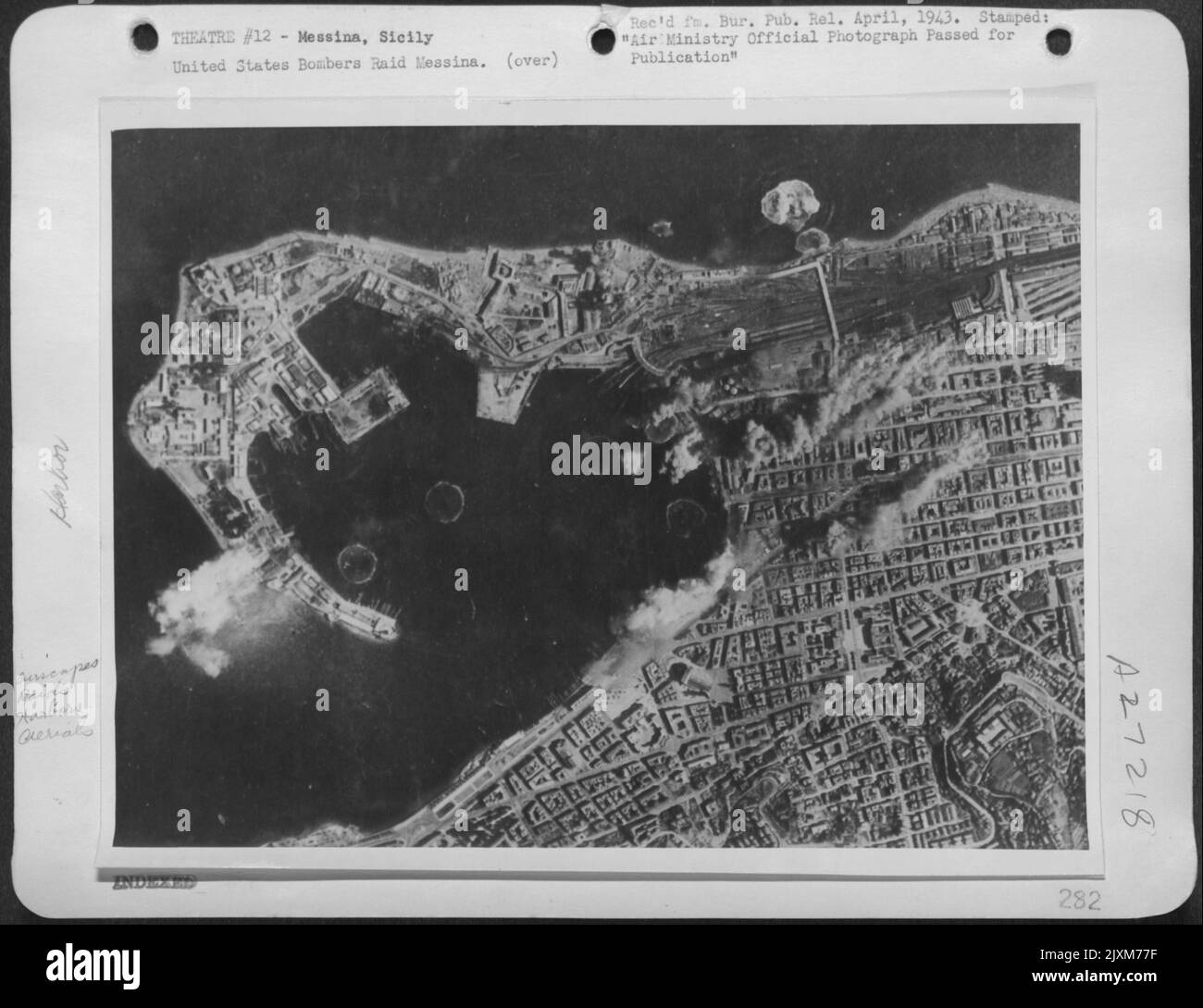 United States Bombers Raid Messina. Plumes of smoke rise from bomb-hits ...