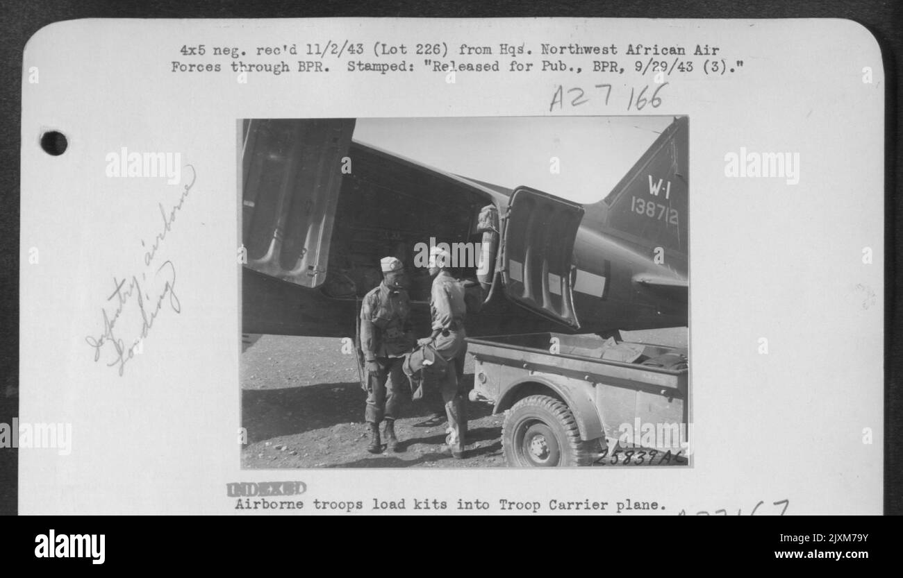 Airborne troops load kits into Troop Carrier plane Stock Photo - Alamy