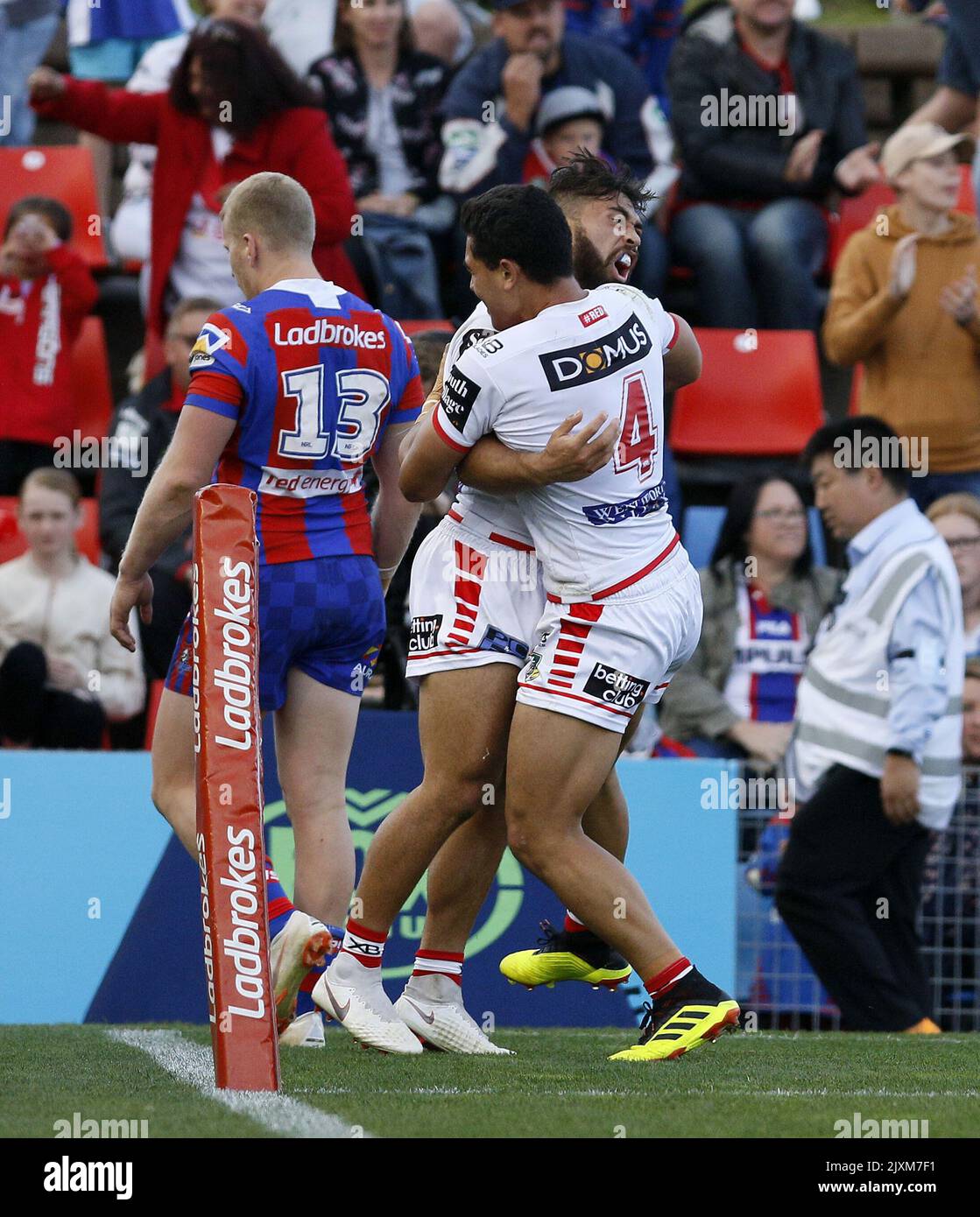 Jordan Pereira of the Dragons celebrates a try with Timoteo Lafai ...