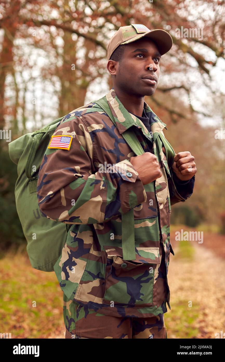 American Soldier In Uniform Carrying Kitbag Returning Home On Leave ...
