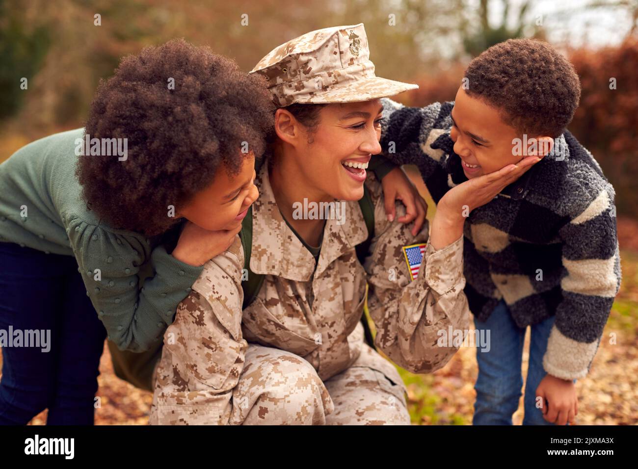 American Female Soldier In Uniform Returning Home On Leave To Family ...
