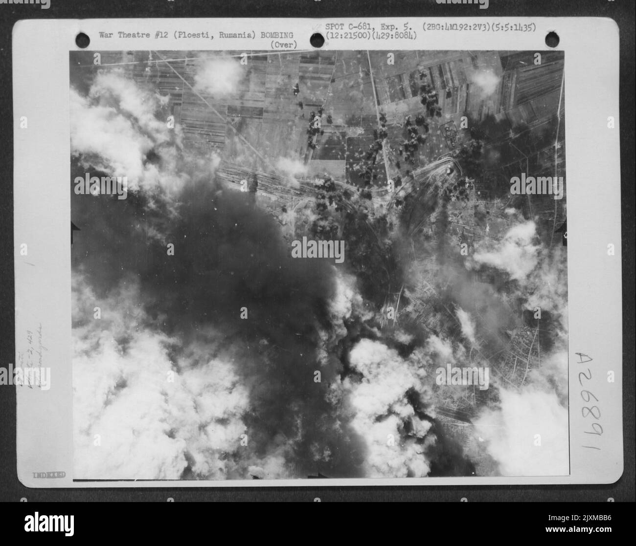 Smoke billows up from the marshalling yards at Ploesti, Rumania during ...