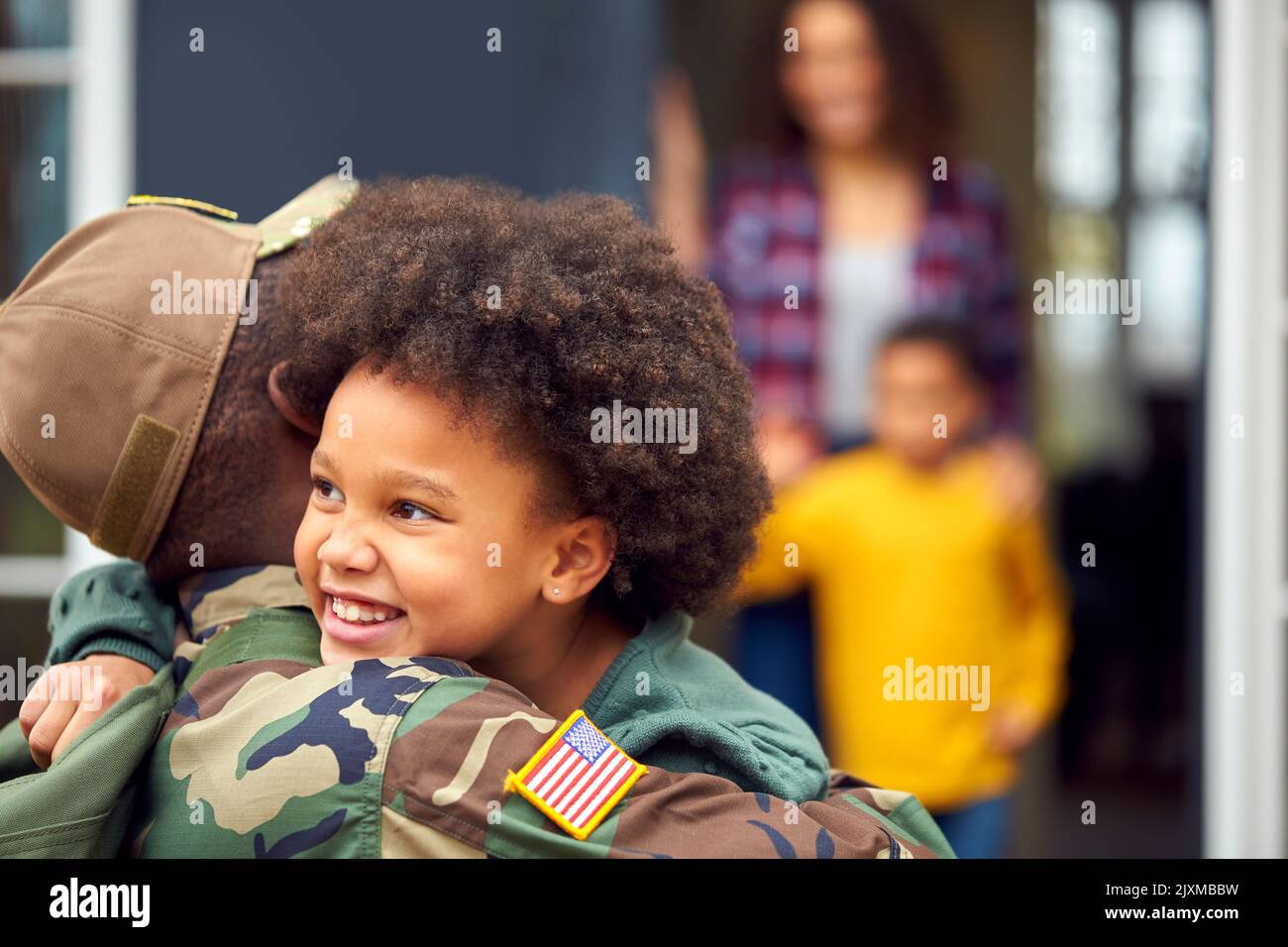 American Soldier In Uniform Returning Home To Family On Hugging ...