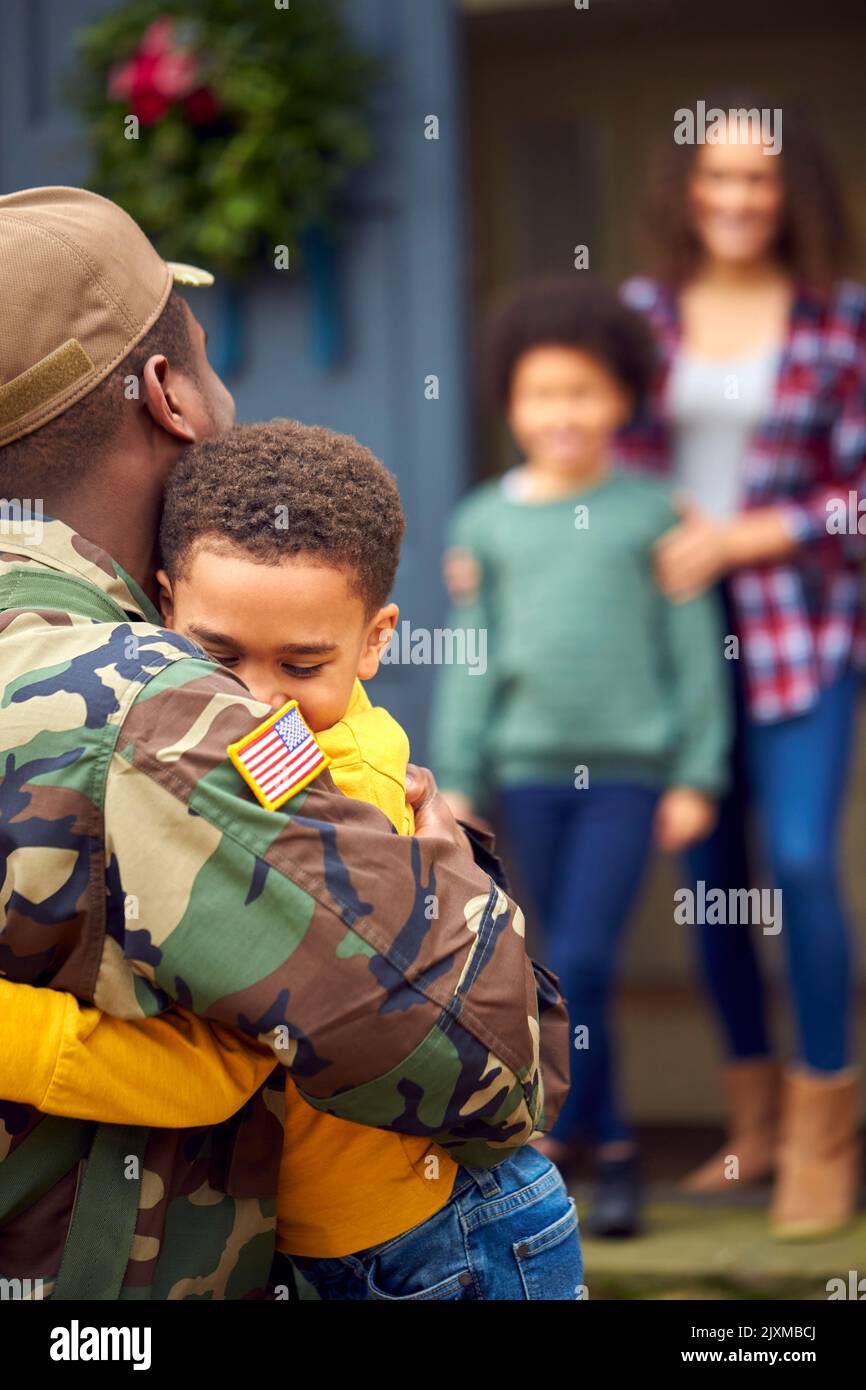American Soldier In Uniform Returning Home To Family On Hugging ...