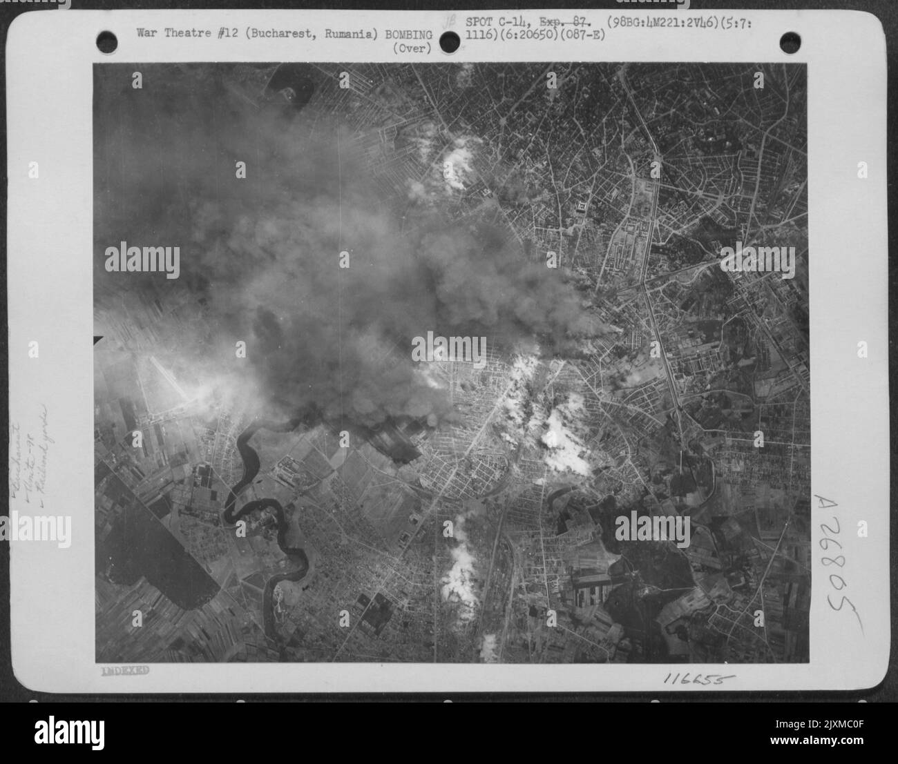 Smoke covers the target area as bombs burst on the marshalling yards at ...