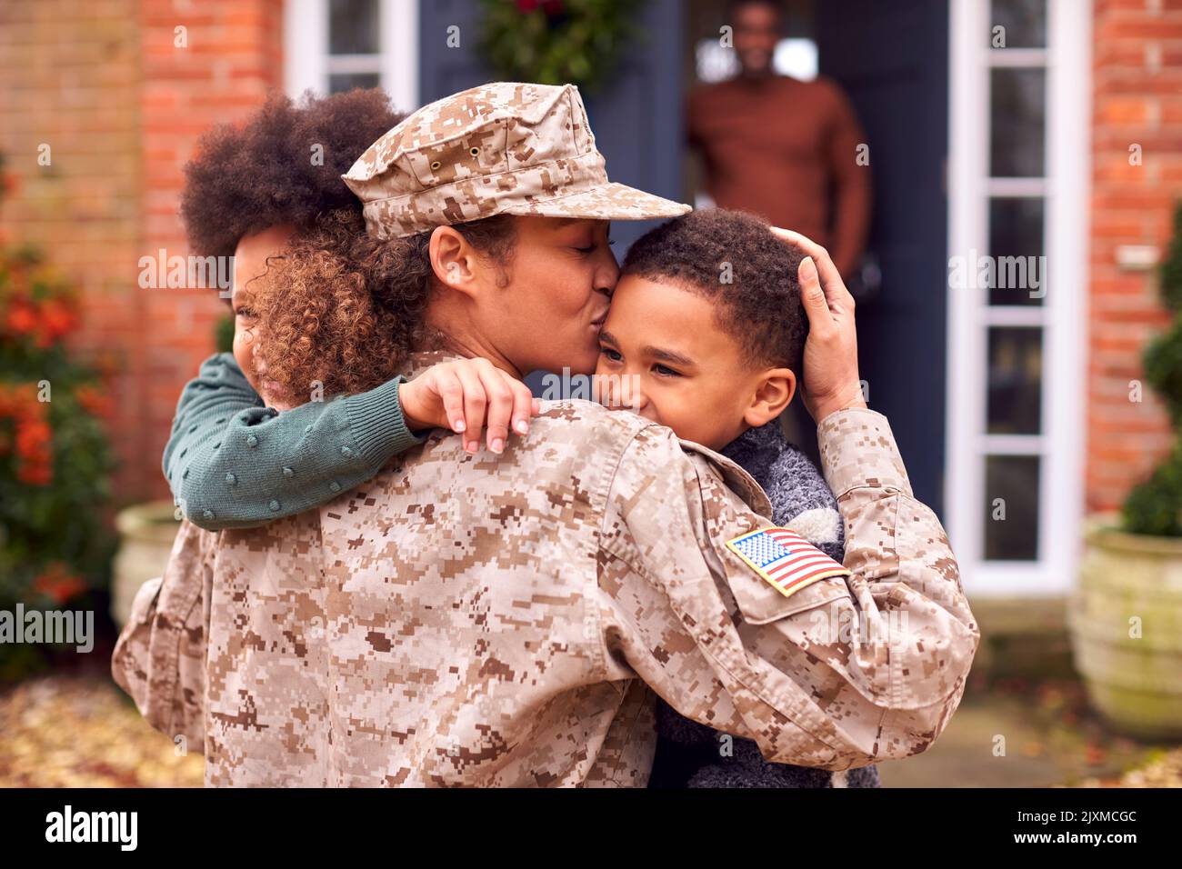 American Female Soldier In Uniform Returning Home To Family On Hugging ...