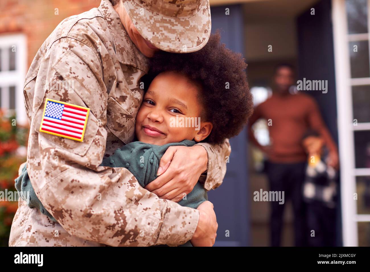 American Female Soldier In Uniform Returning Home To Family On Hugging ...