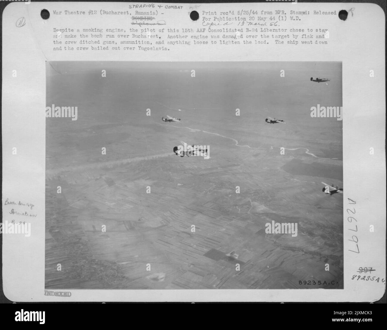 Despite a smoking engine, the pilot of this 15th AAF Consolidated B-24 ...