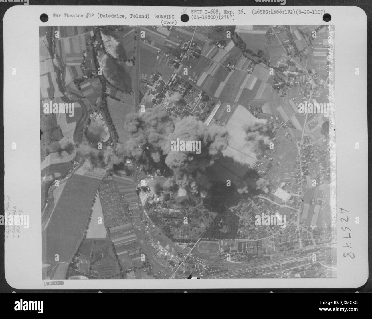 Smoke from bomb bursts covers the target after planes of the 465th Bomb ...