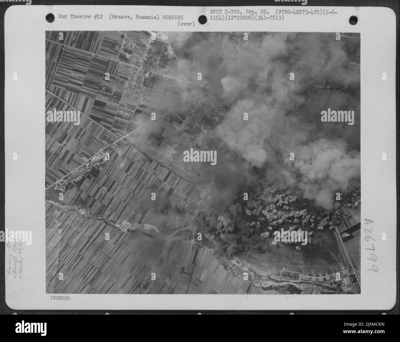 Bombs burst on the aircraft factory at Brasov, Rumania as planes of the ...