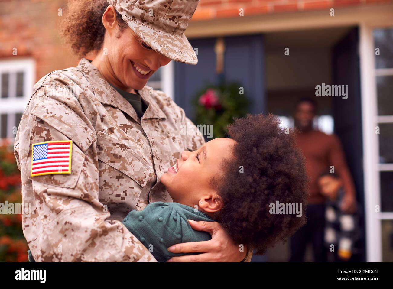 American Female Soldier In Uniform Returning Home To Family On Hugging ...