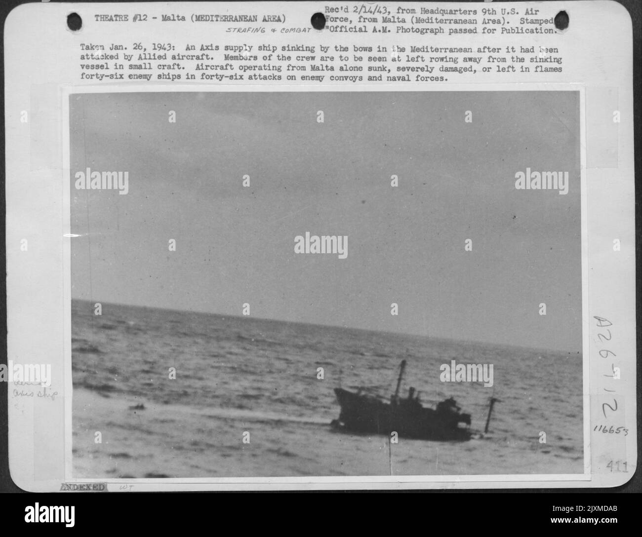 Taken Jan. 26, 1943: An Axis supply ship sinking by the bows in the ...