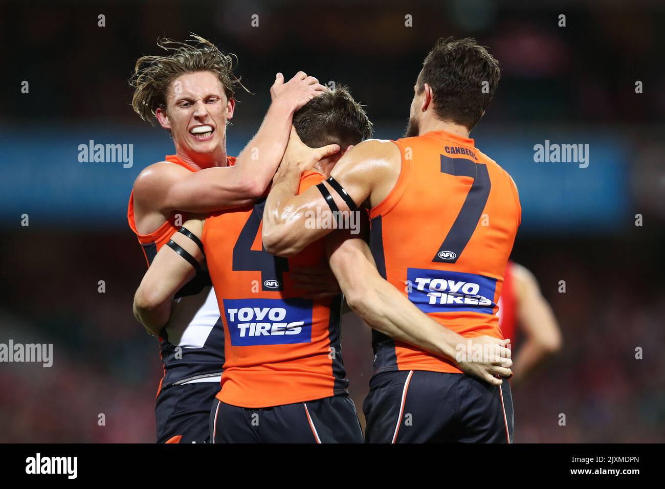 Toby Greene of the Giants celebrates kicking a goal with team mates ...